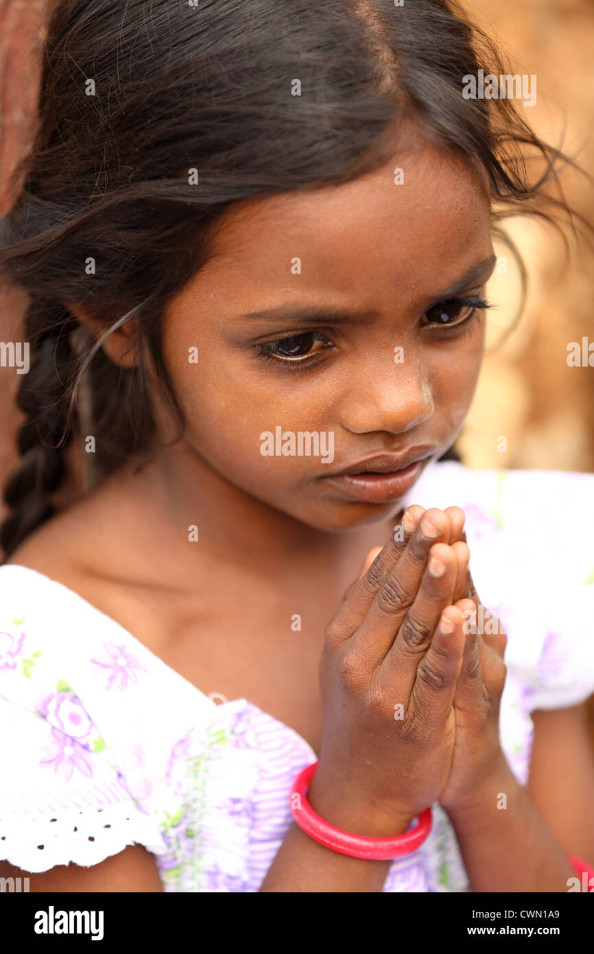 Young Indian rural girl in prayers Andhra Pradesh South India Stock ...