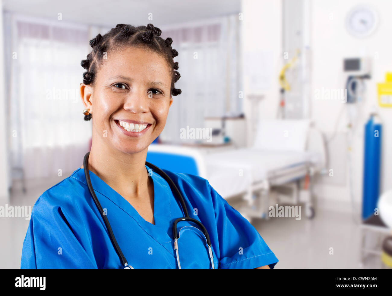 happy african female nurse in hospital Stock Photo - Alamy