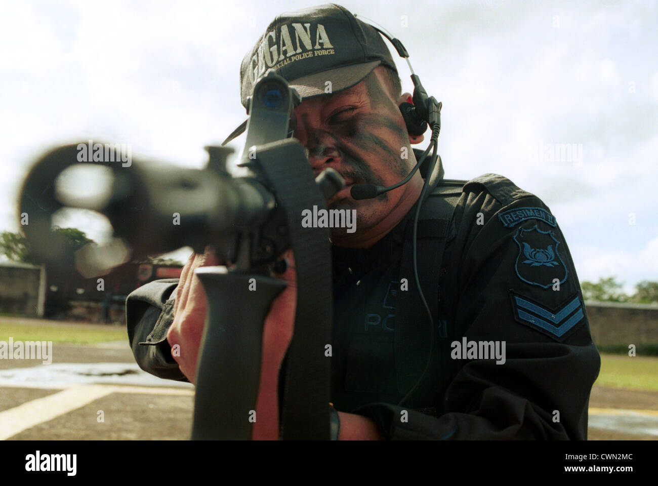 Members of Gegana, the Indonesian Police special response unit, aiming ...