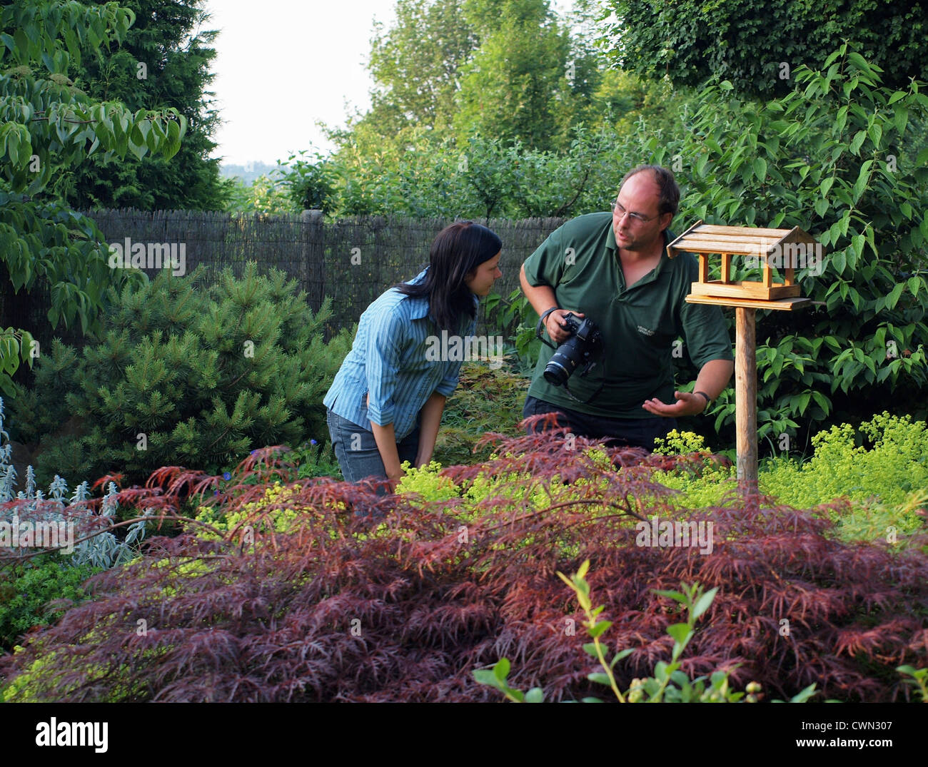 Model and Photographer in Garden Stock Photo - Alamy