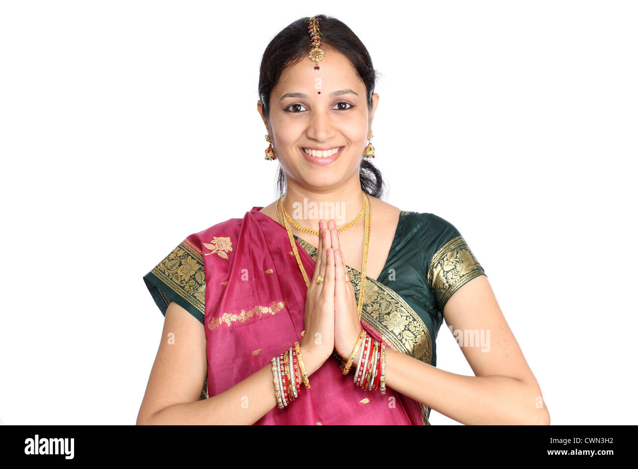 Traditional Indian girl holding hands in prayer position Stock Photo ...