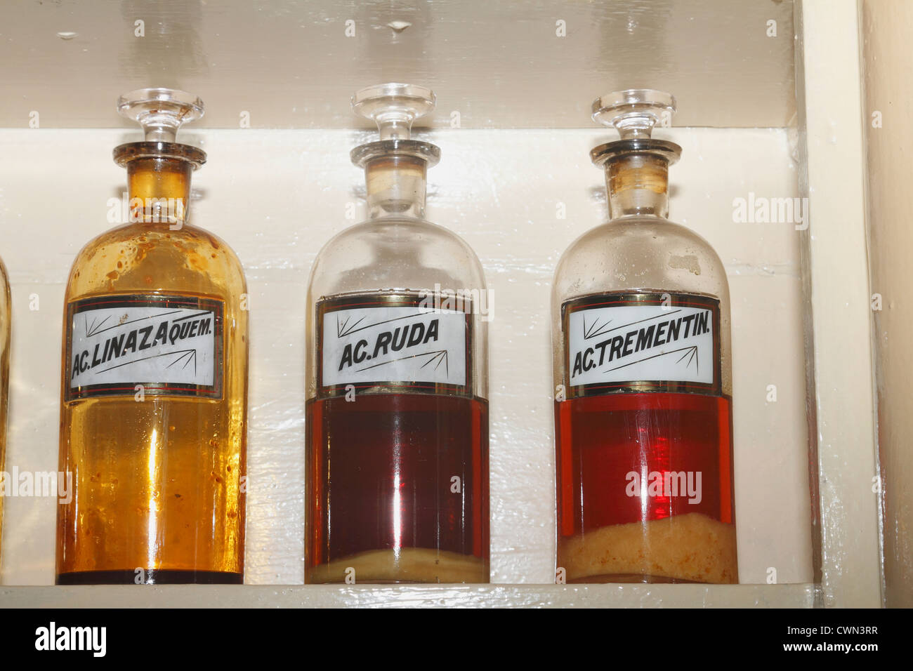 Vintage medical pharmaceutical colorful chemical bottles on the shelf ...