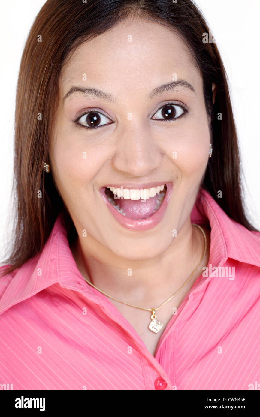 Headshot of excited woman against white background Stock Photo - Alamy