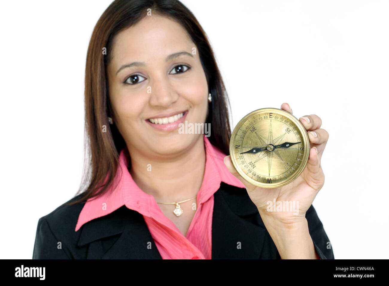 Happy business woman holding a directional compass Stock Photo - Alamy