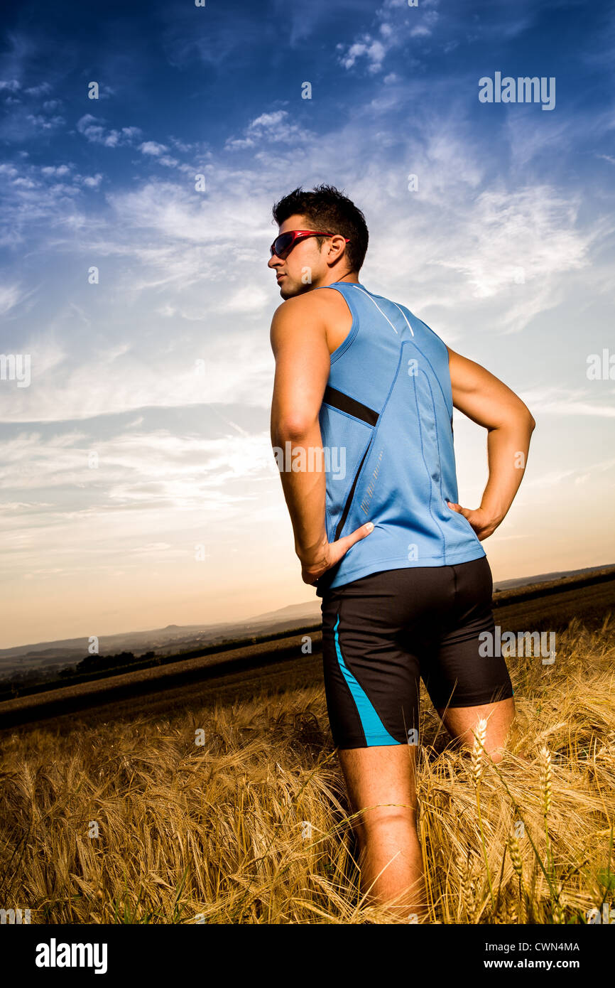 man jogging through the fields Stock Photo - Alamy