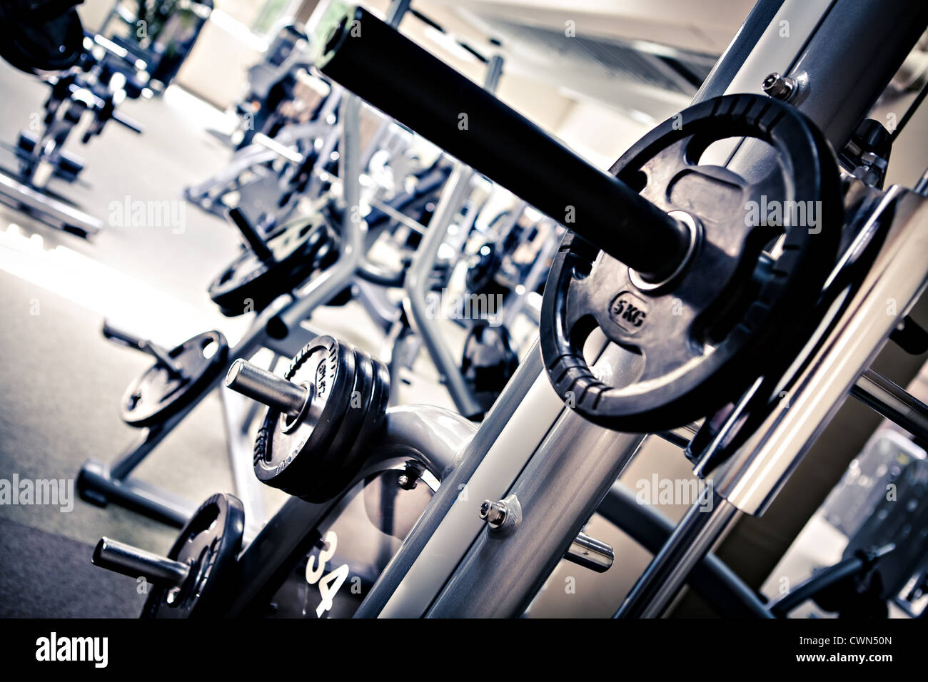 diverse equipment and machines at the gym room Stock Photo - Alamy