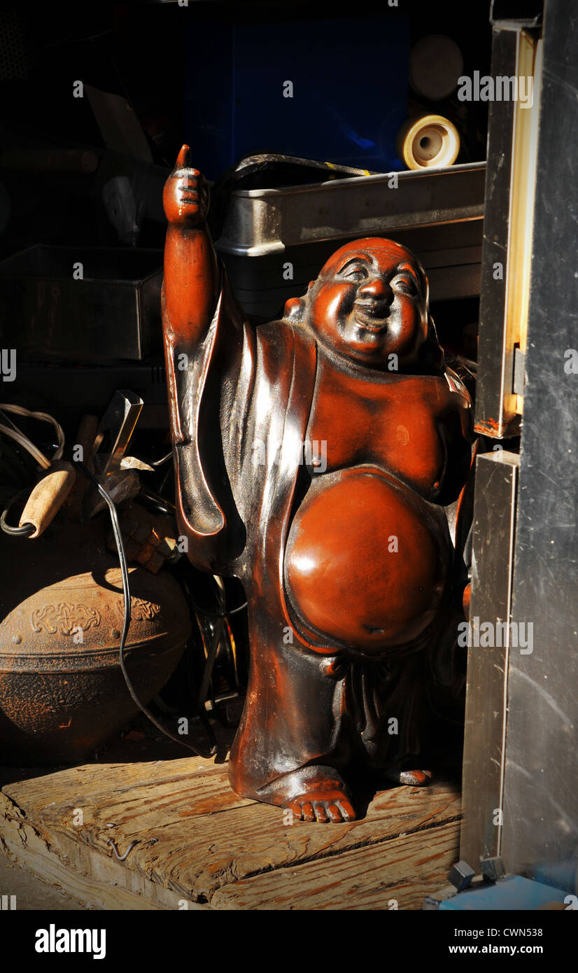 Old wooden Fat Buddha statue in antiquity store in Asakusa, Tokyo ...