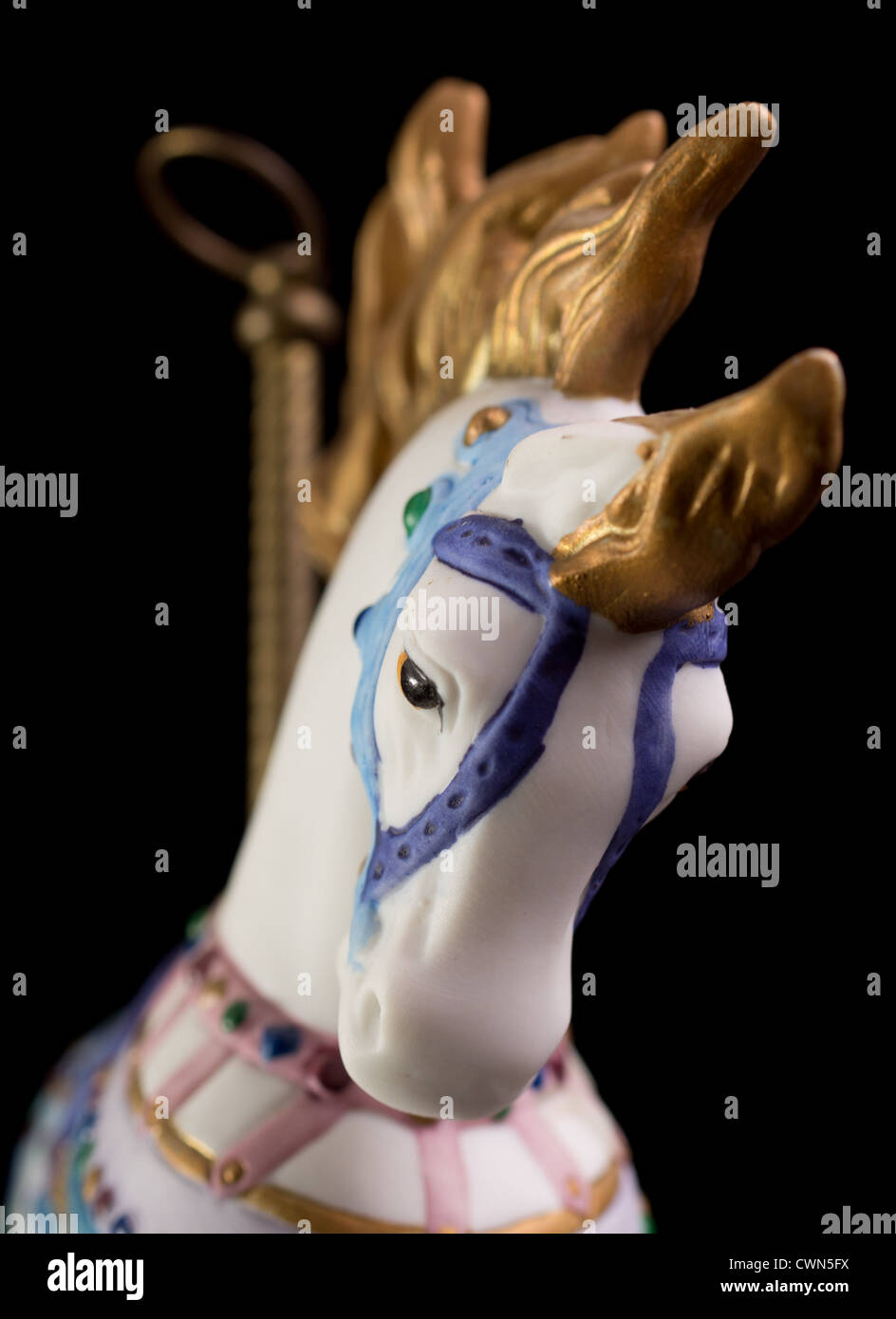 Colorful carousel horse isolated on black background Stock Photo - Alamy