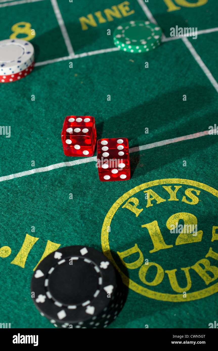 Craps table with casino chips and dice Stock Photo - Alamy