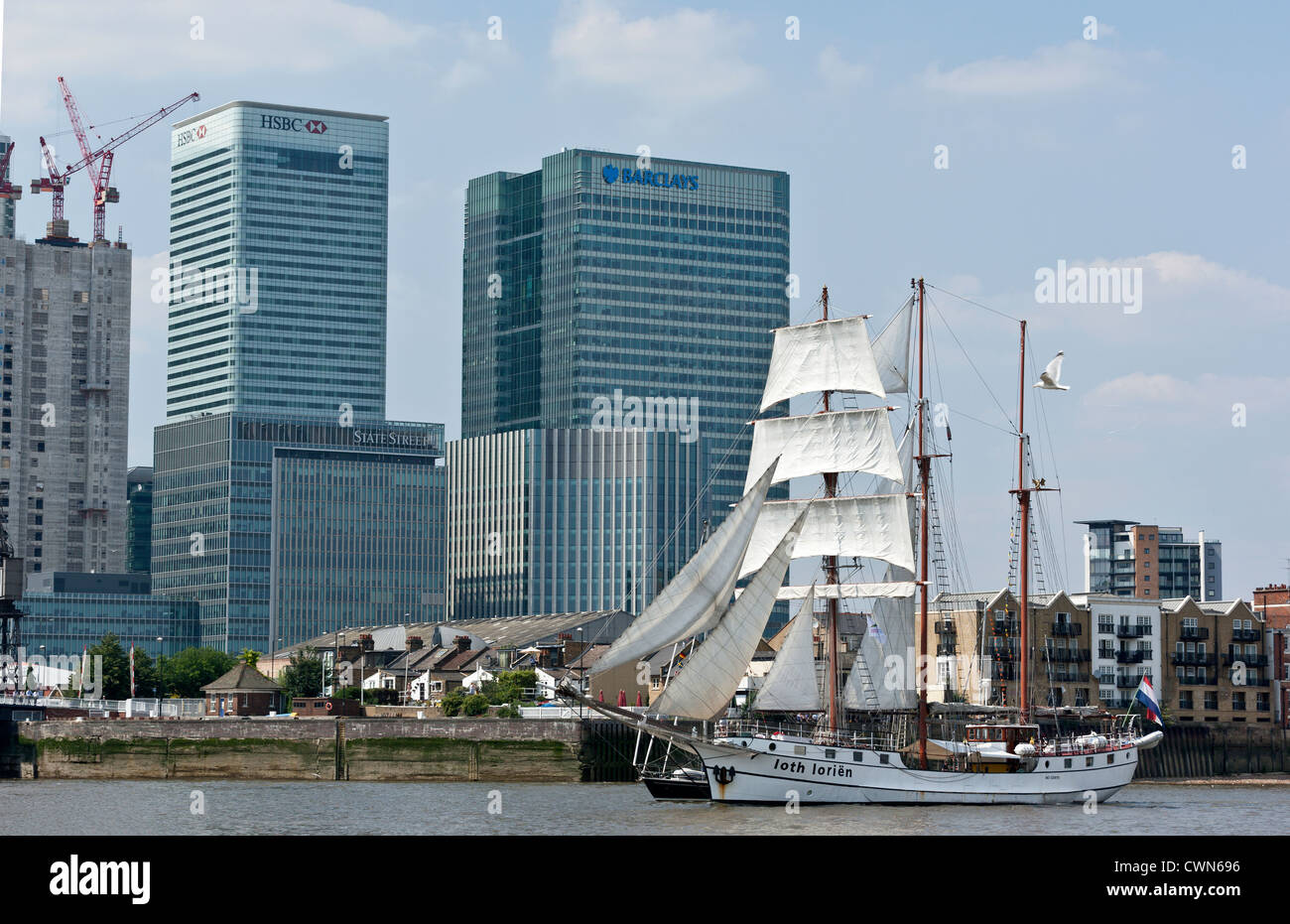 A Dutch tall ship sailing on the River Thames in front of the large ...