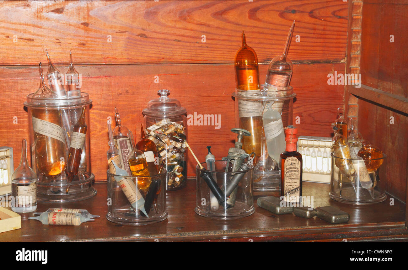 Vintage medical pharmaceutical colorful chemical bottles on the shelf ...