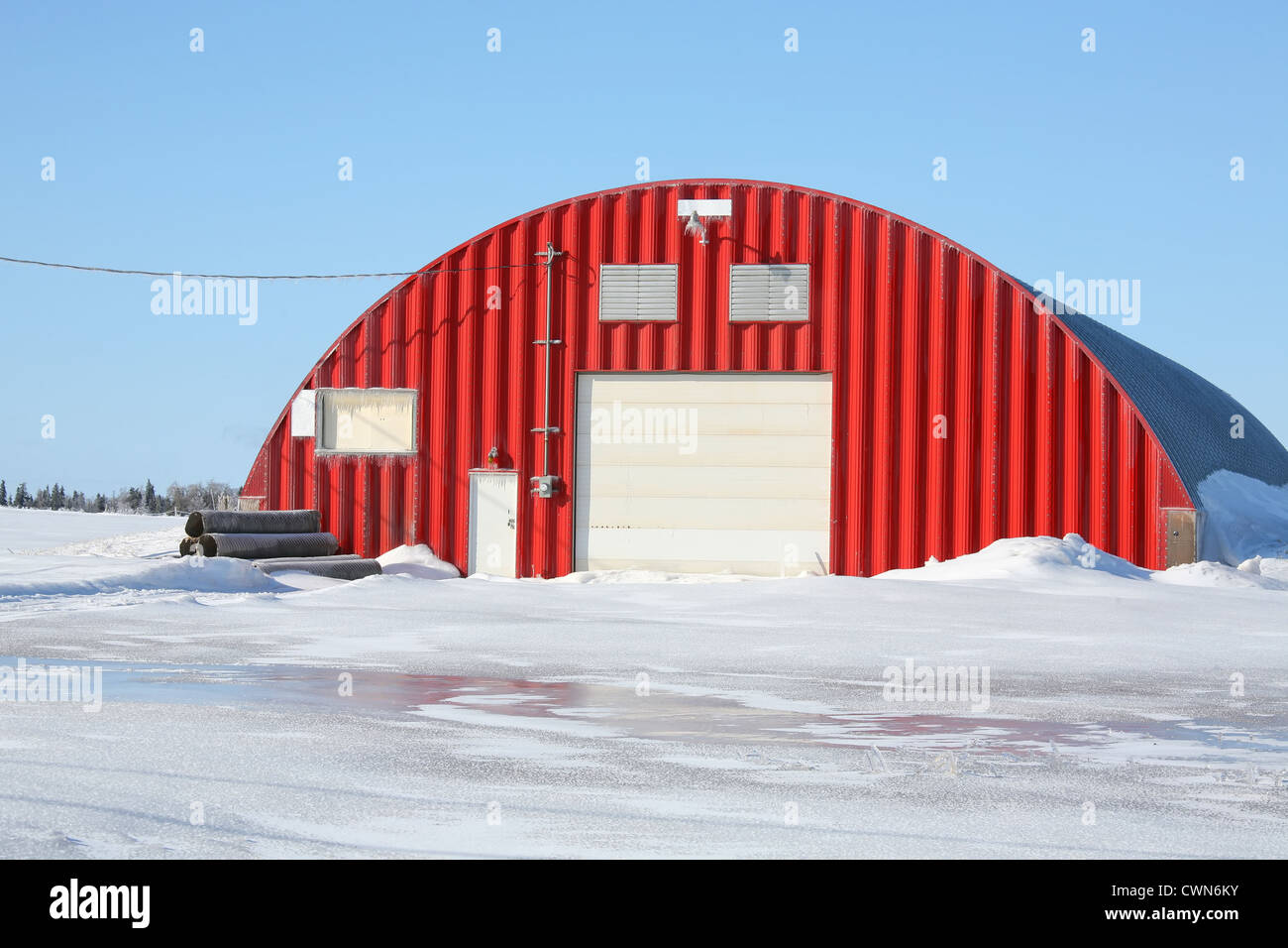 Potato storage warehouse facility surrounded by ice and snow on Prince ...