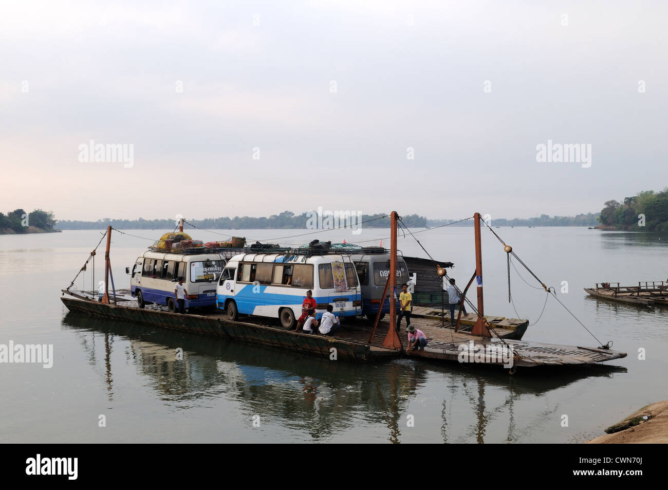 Mini Buses on an early ferry boat on the mekong River Don Khong ...