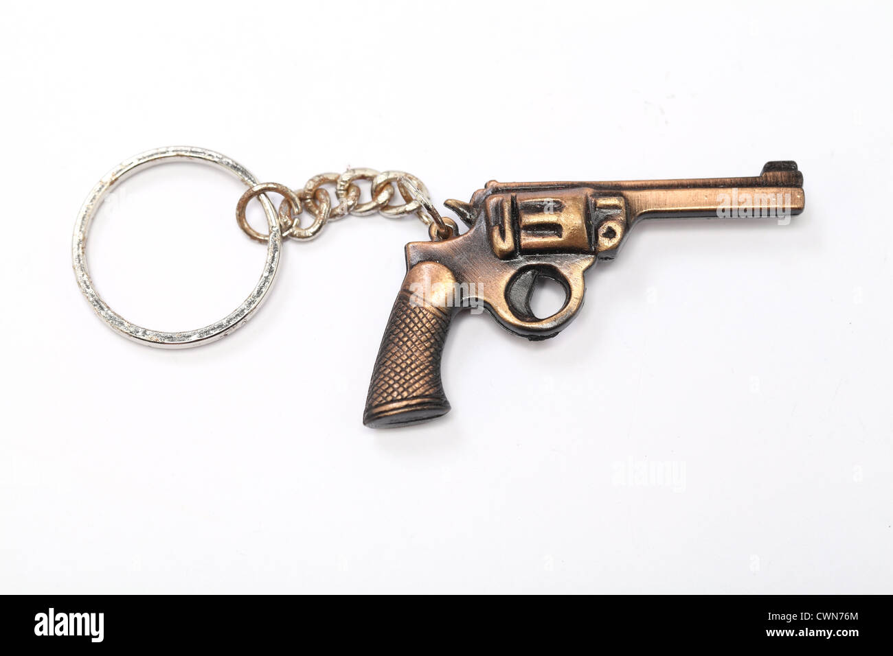 Toy gun with key chain on white background Stock Photo - Alamy