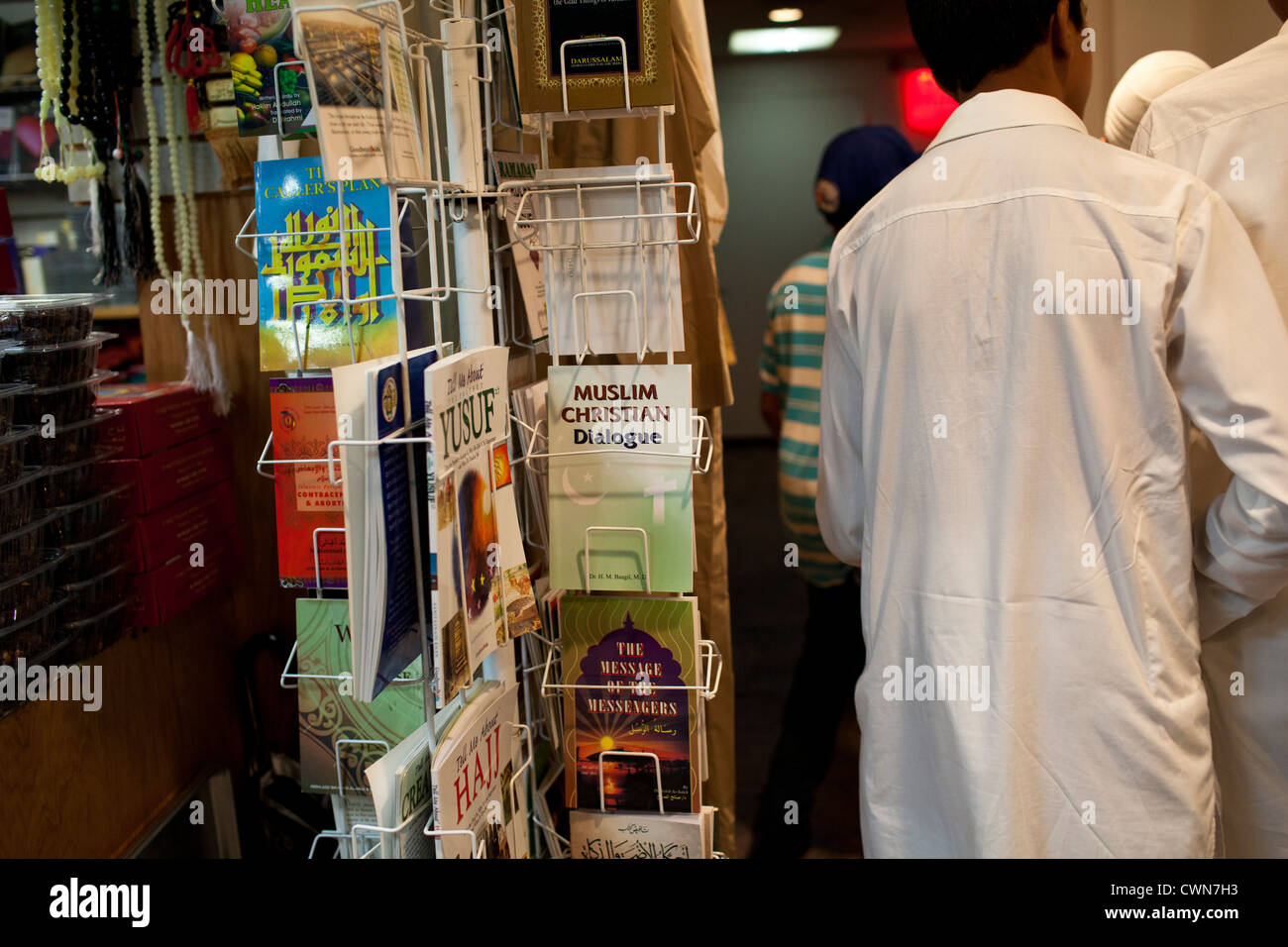 Muslims walk through an Islamic bookstore in a New York City mosque ...
