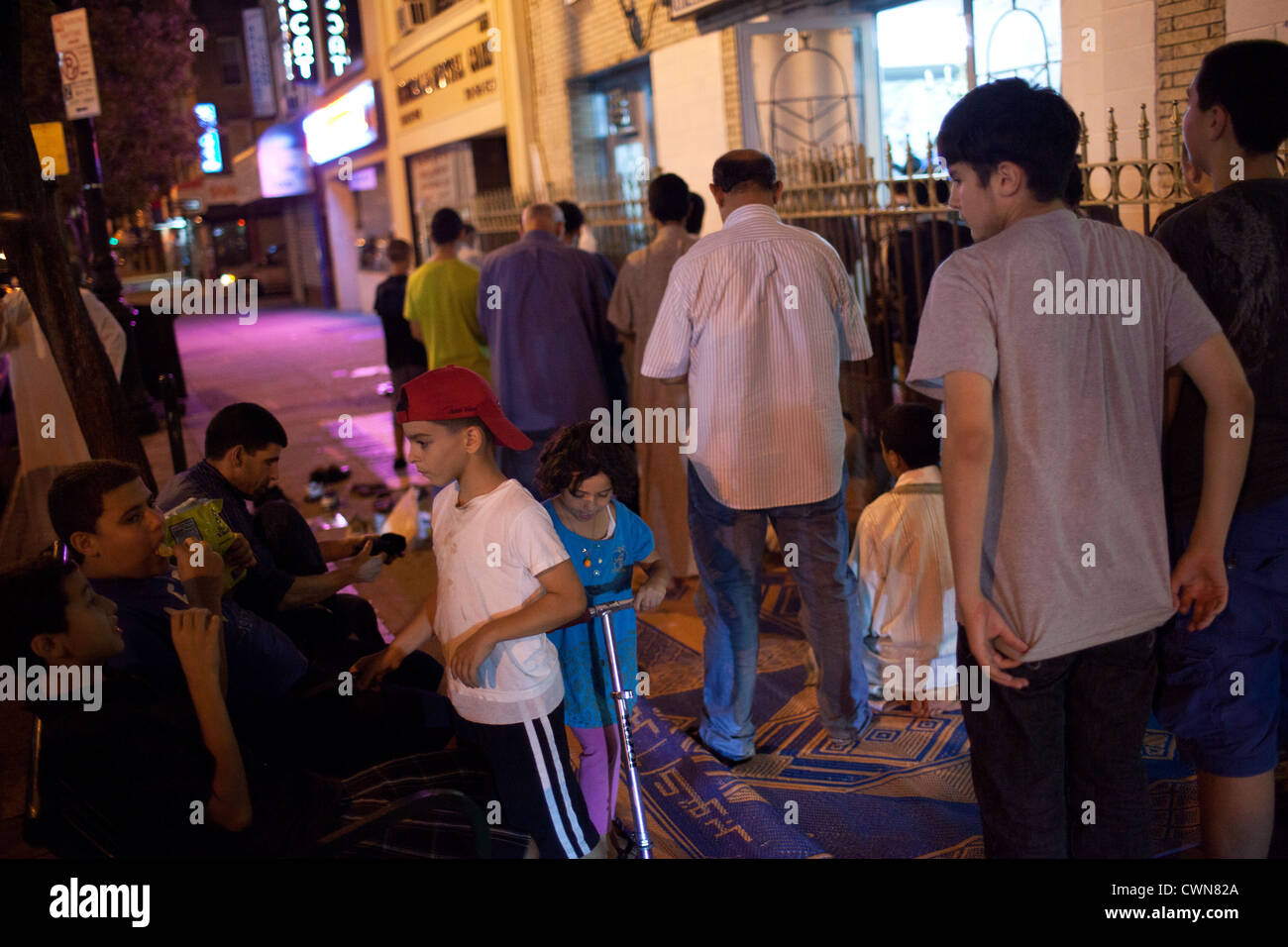 Muslim men pray outside a mosque during the month of Ramadan in ...
