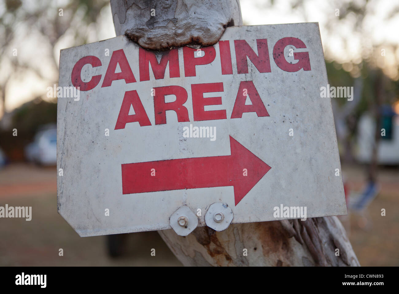 Camping area sign attached to a tree in an outback camp site in Broome ...