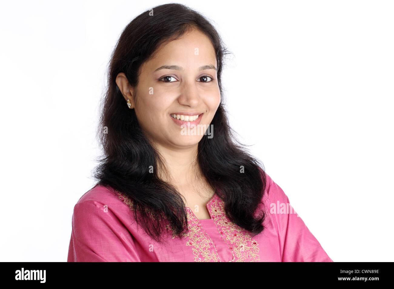 Confident Indian young woman against white Stock Photo - Alamy