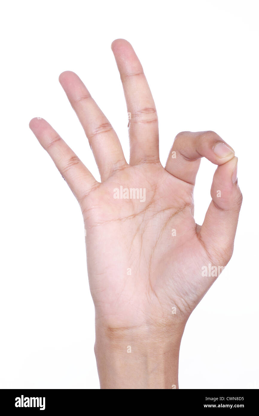 Hand showing OK sign against white background Stock Photo - Alamy