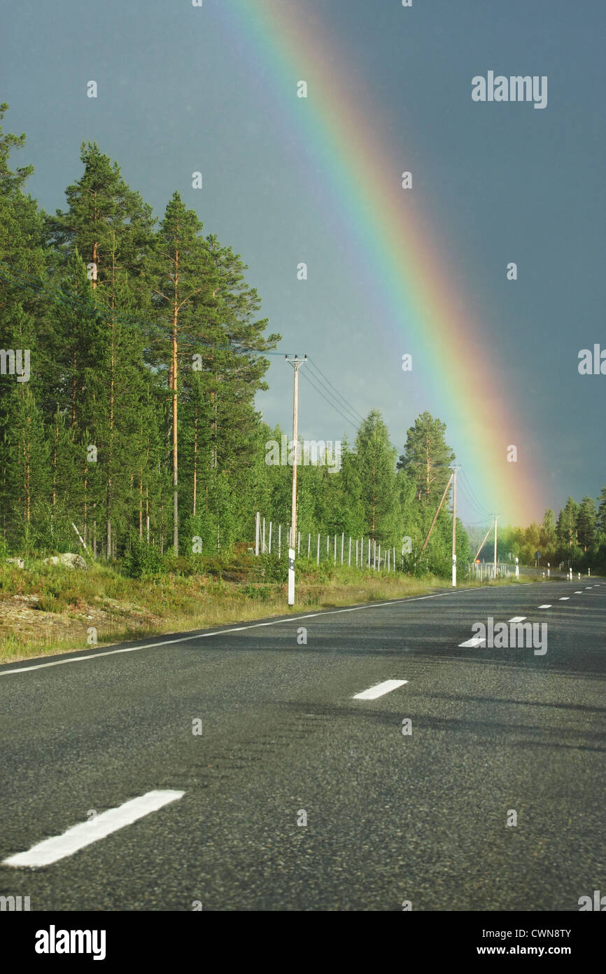 Rainbow over the road Stock Photo - Alamy
