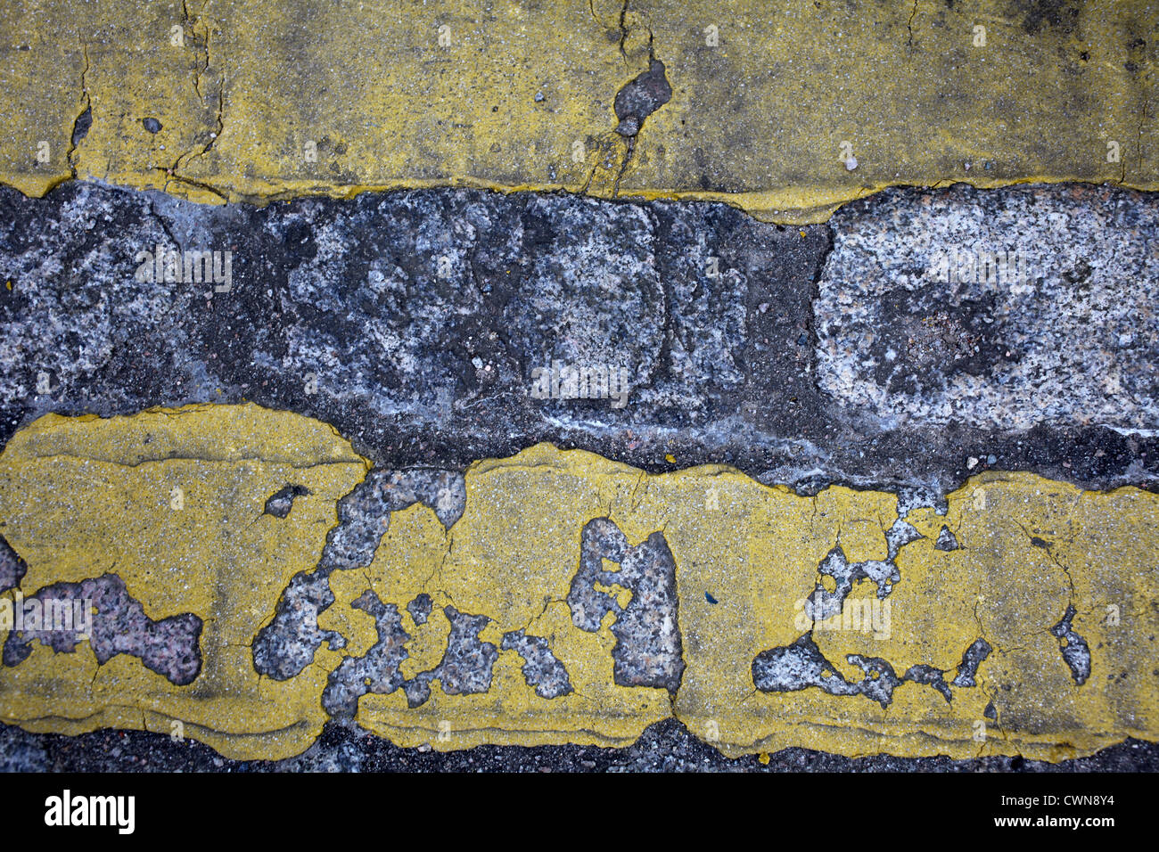 Double yellow line along footpath Stock Photo - Alamy