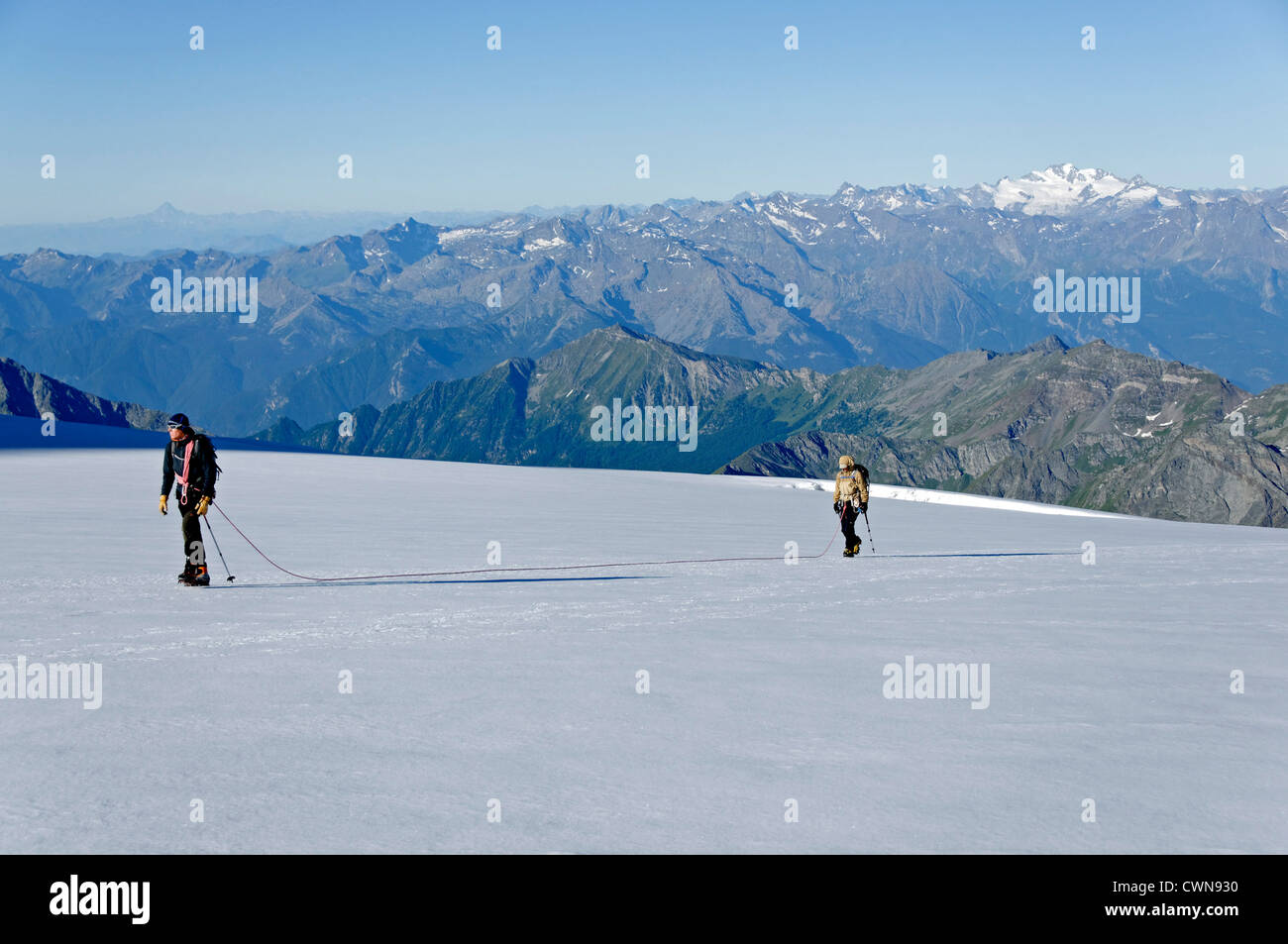 Alpine climbers traveling on a glacier in the Swiss alps Stock Photo ...