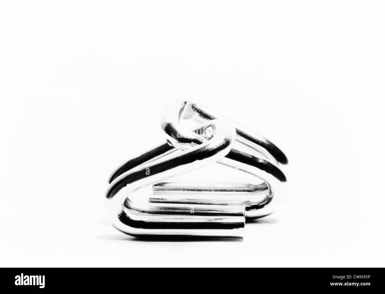 Linked metal puzzle Stock Photo - Alamy