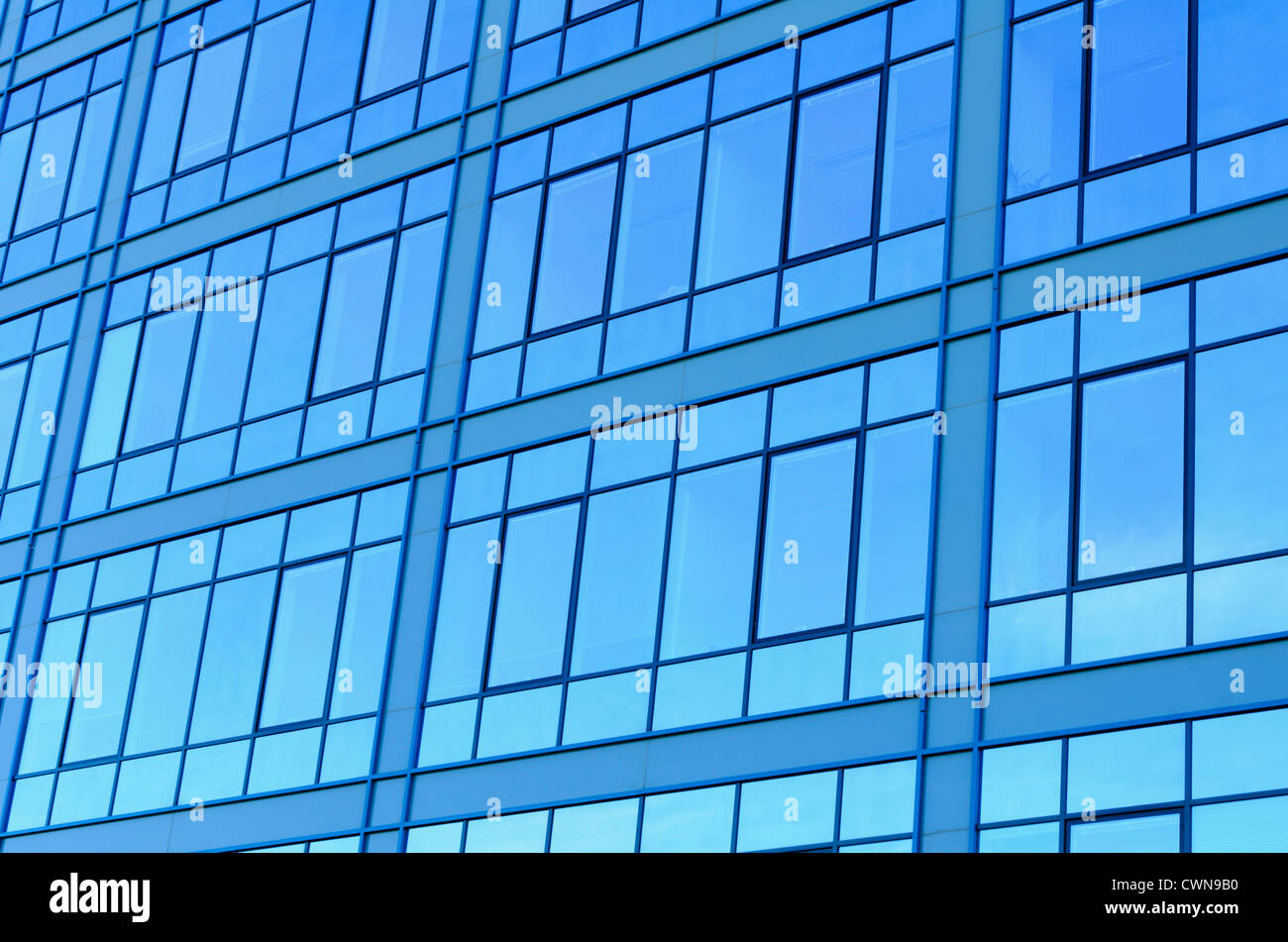 Windows reflecting blue sky Stock Photo - Alamy