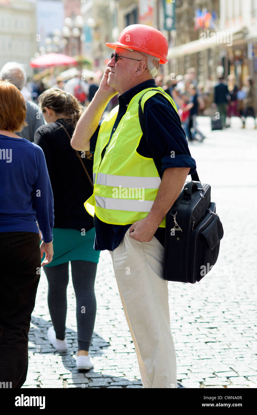 Man in hard hat with laptop and mobile Stock Photo - Alamy