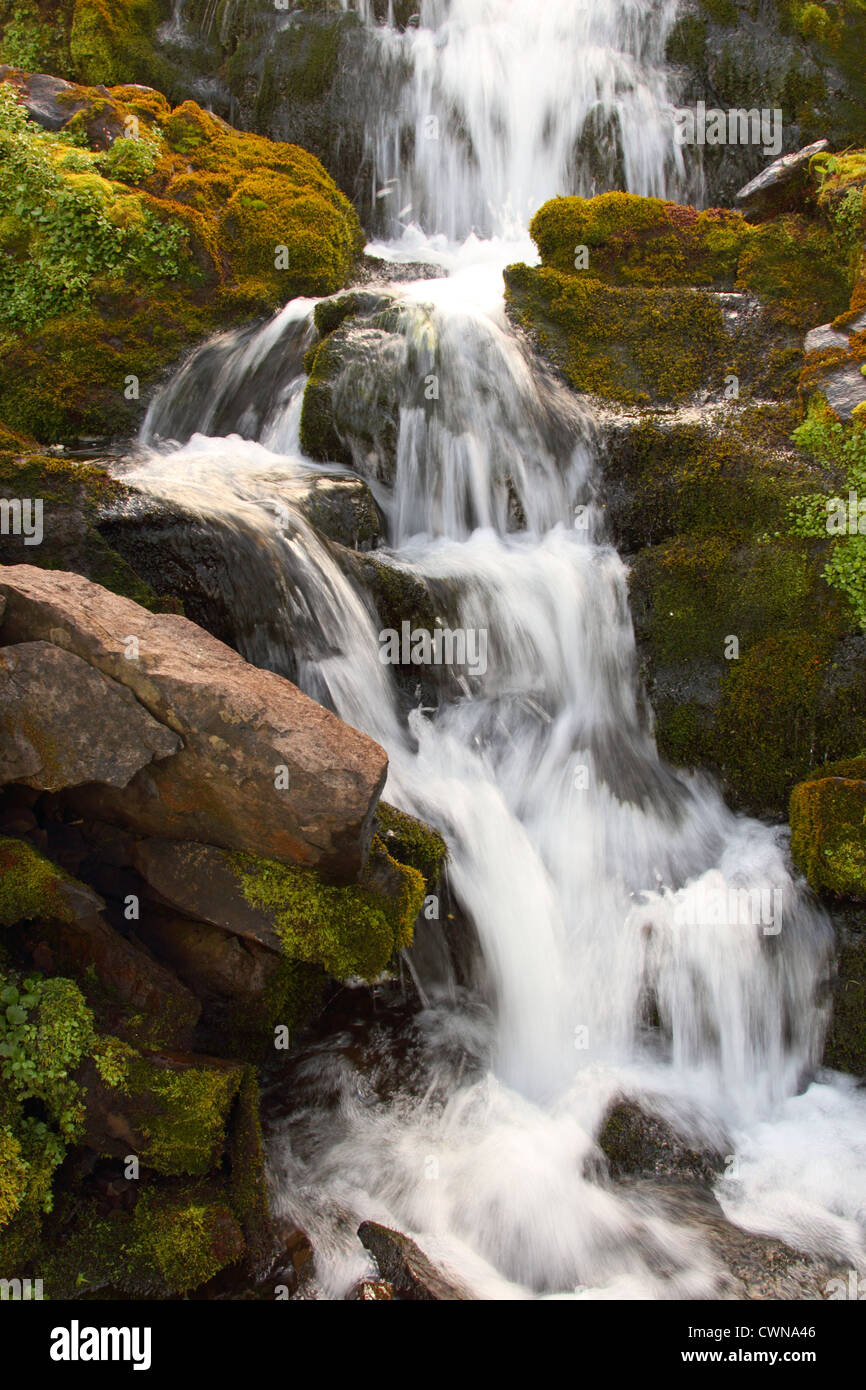 A waterfall cascades over rocks Stock Photo - Alamy