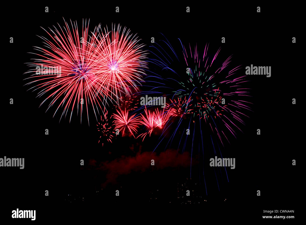 A photograph of a fireworks display at night Stock Photo - Alamy