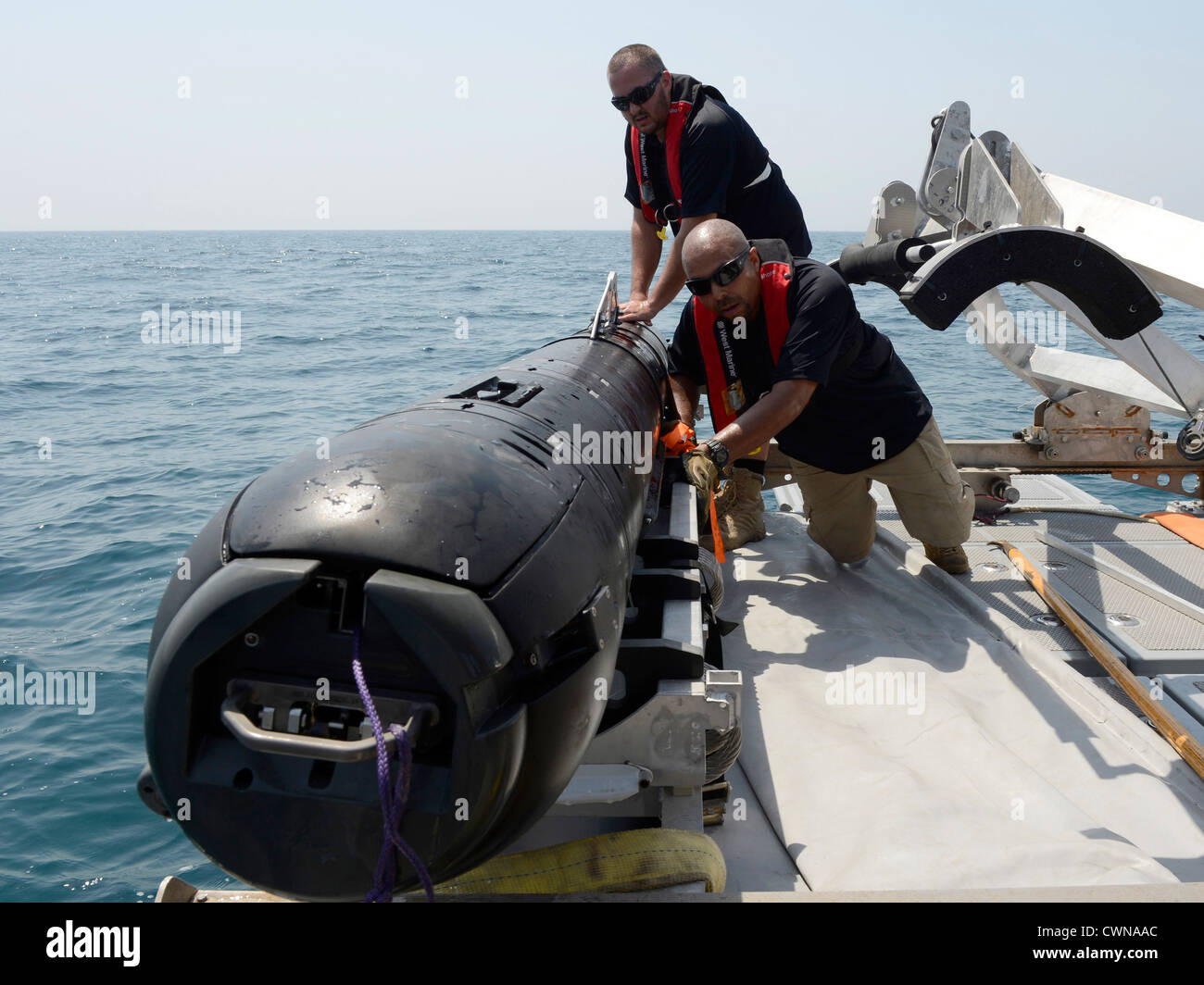 Civilian contractors secure an M18 Mod 2 Kingfish unmanned underwater ...