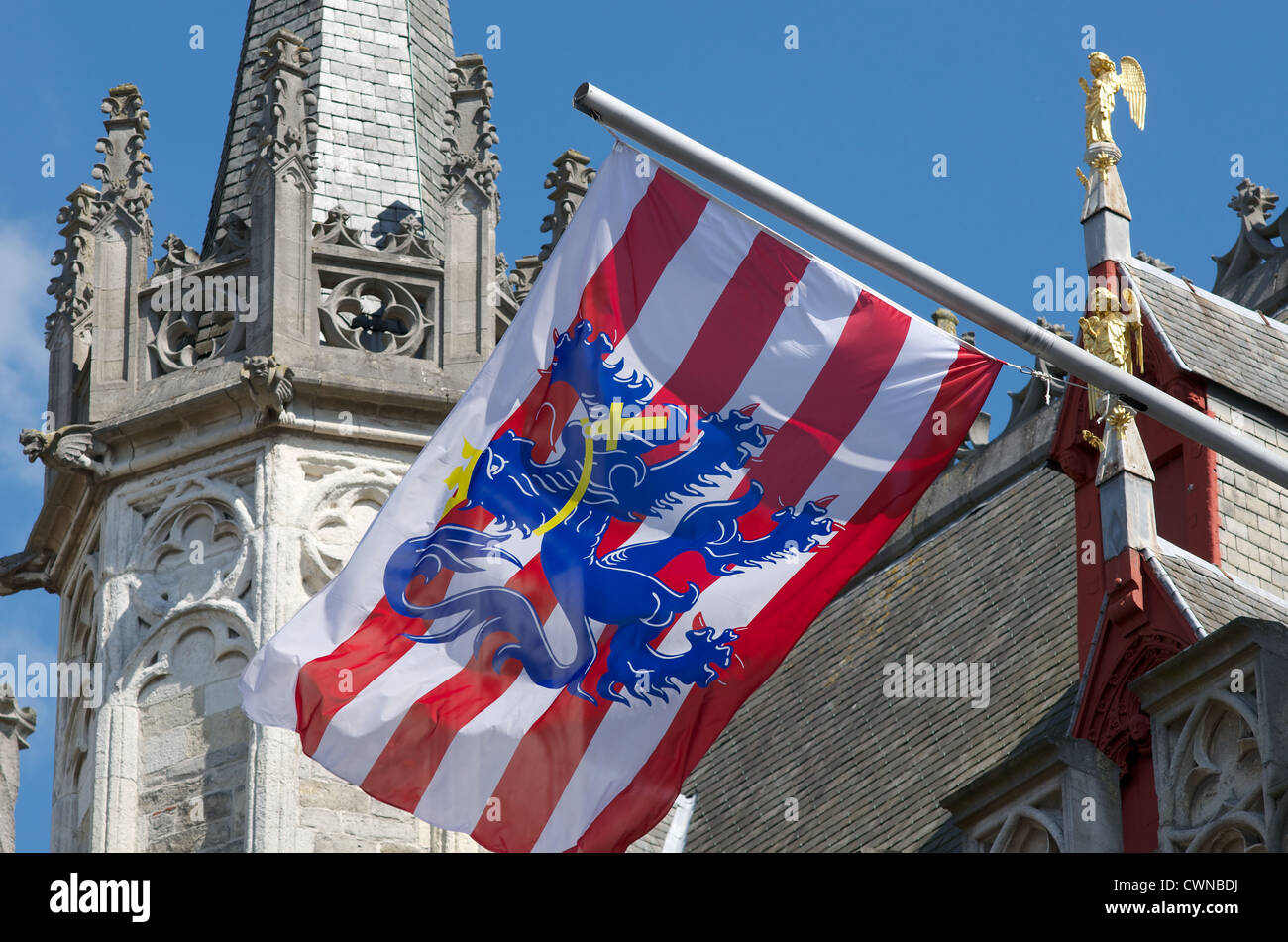 Flemish flag flying on a buttress of the Belfort in Bruges, Belgium ...