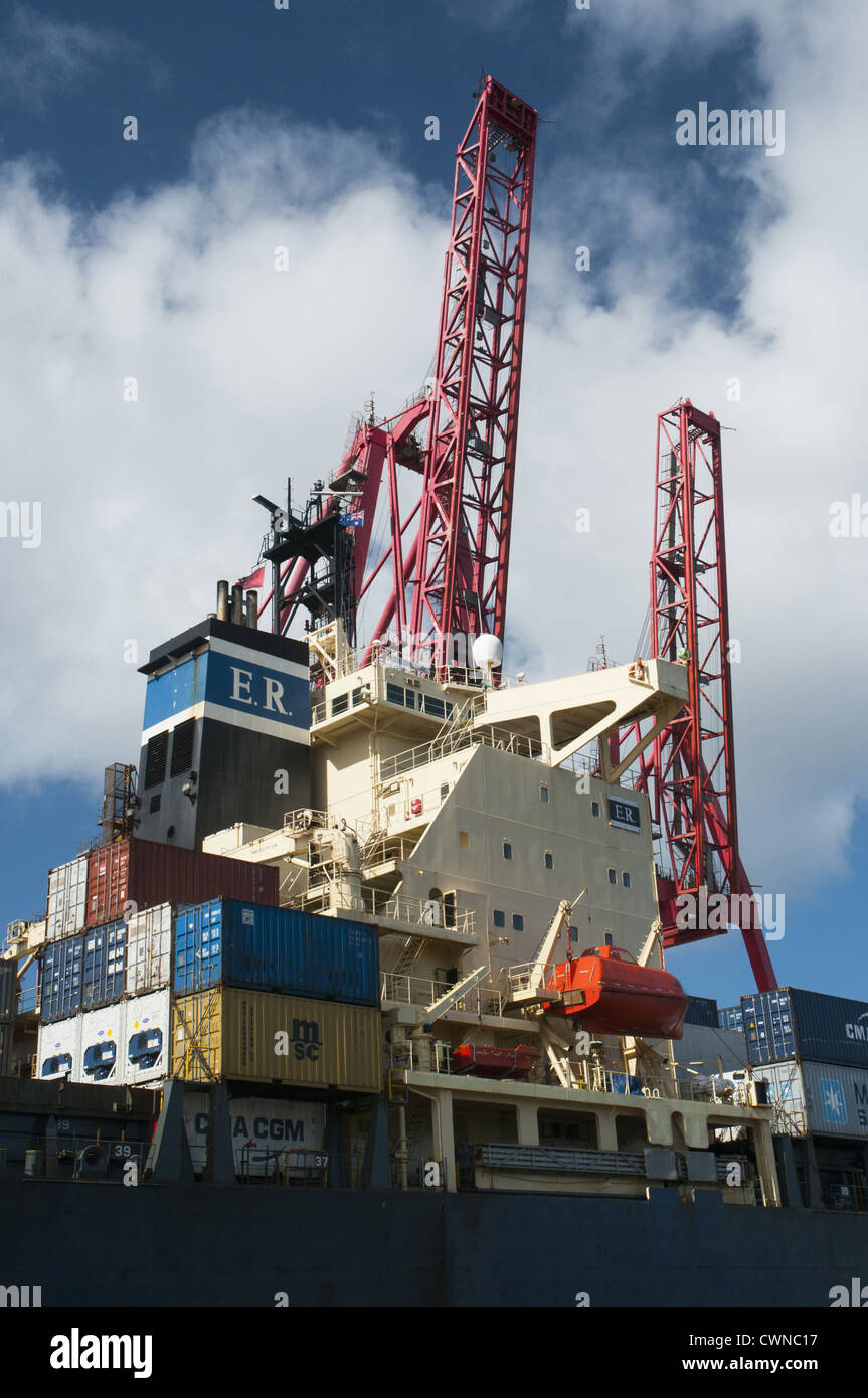 Cranes and gantries load and unload container ships in the Port of ...