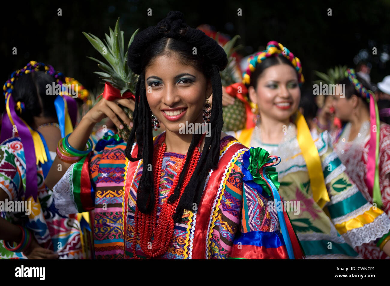 A young woman performs the pineapple dance during the Guelaguetza ...