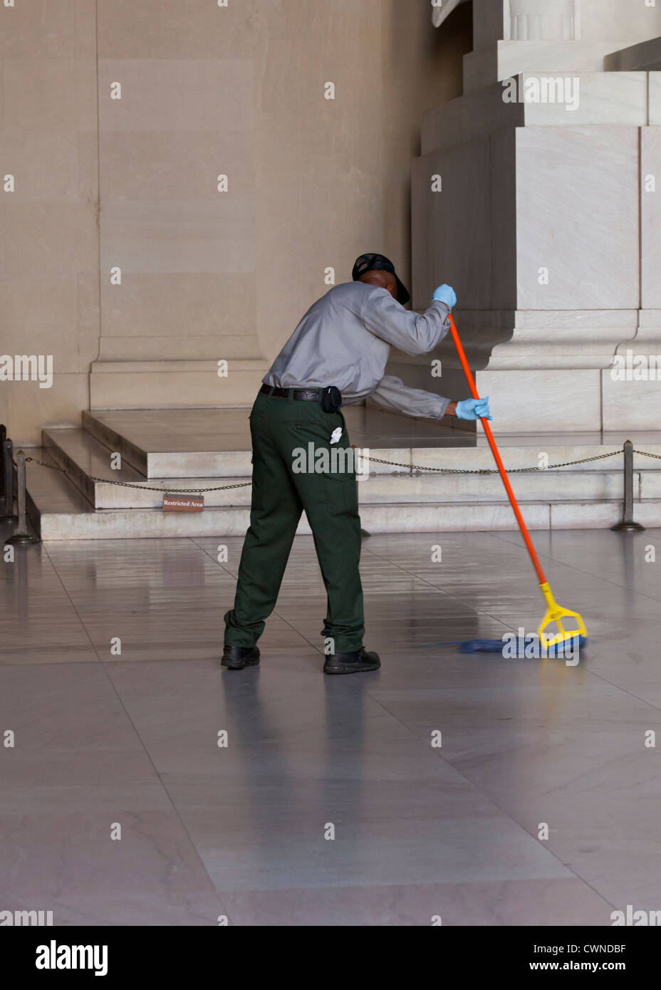 Man mopping a floor Stock Photo - Alamy