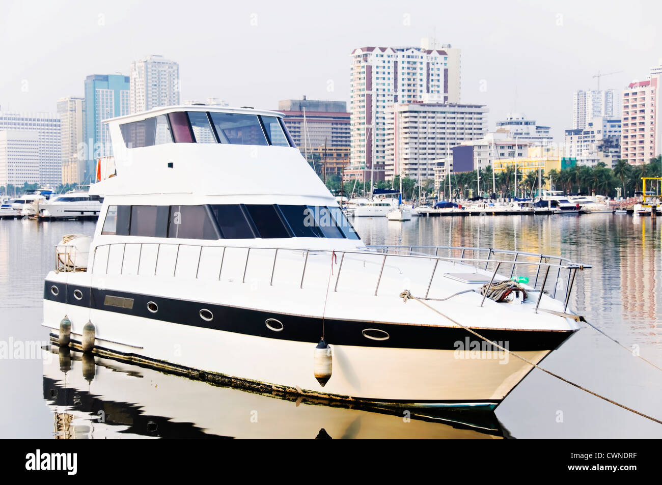 White yacht anchored in Manila Bay, Philippines Stock Photo - Alamy