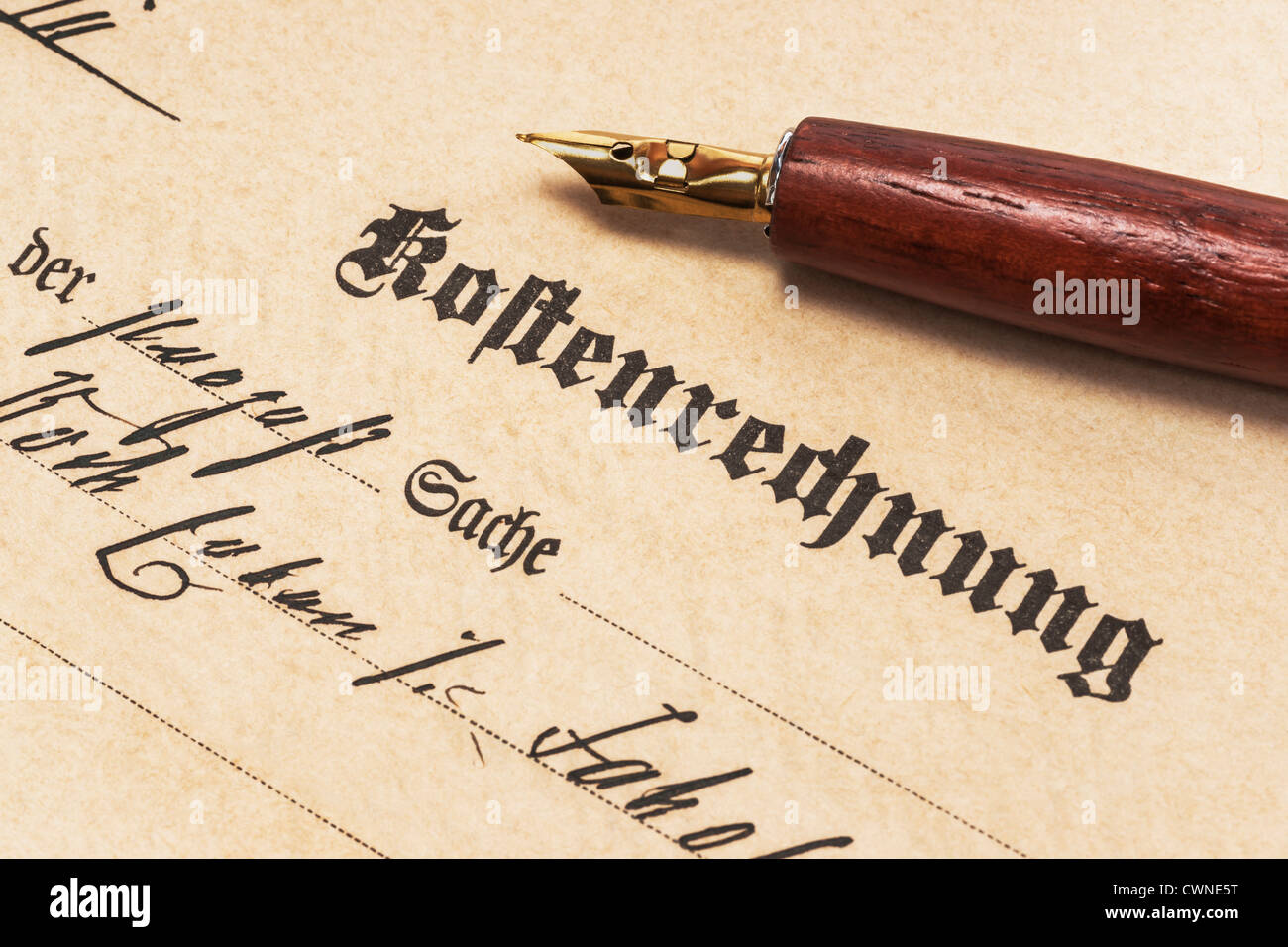 old German costing from the year 1900, a fountain pen is alongside ...