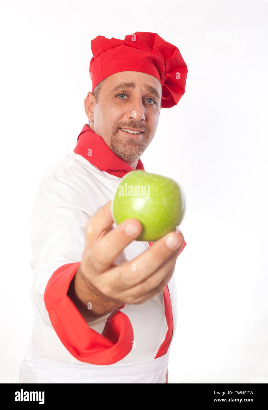 portrait of a chef offering an apple Stock Photo - Alamy