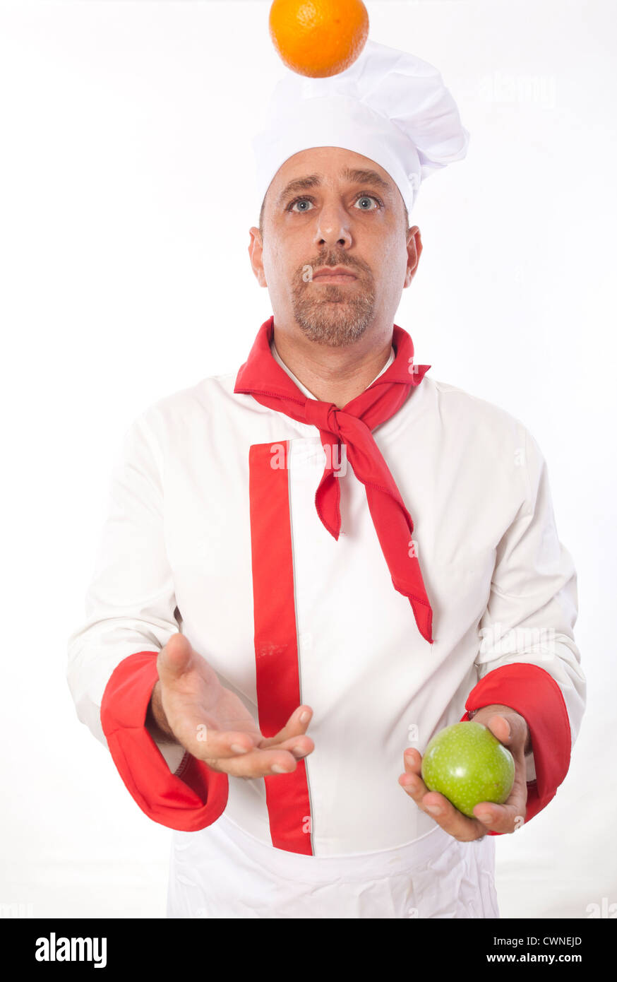 Male chef juggling fruit Stock Photo - Alamy
