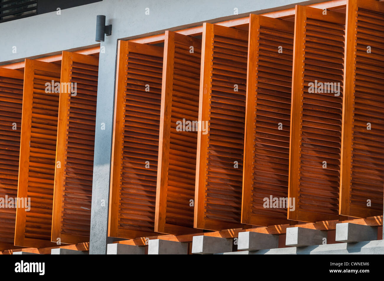Wall with open wooden window shutters Stock Photo - Alamy