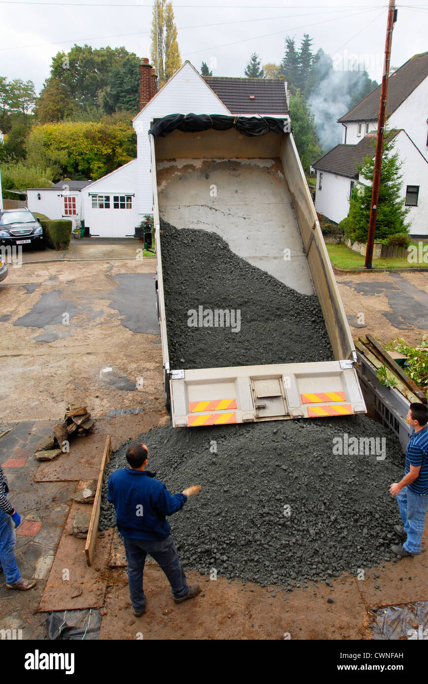 Tipper lorry unloading aggregate Stock Photo - Alamy
