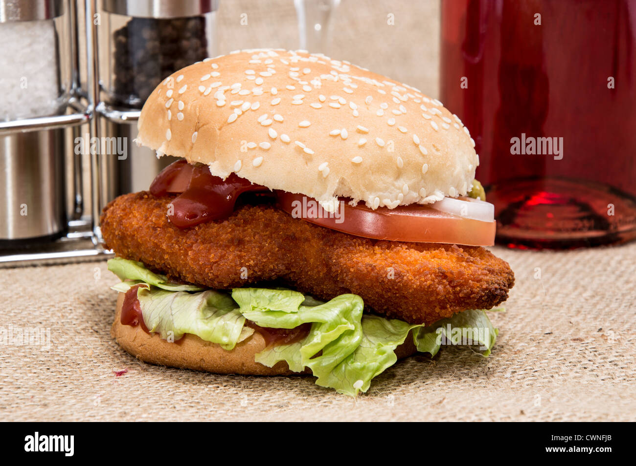 Chicken Burger with ingredients on rustic background Stock Photo - Alamy