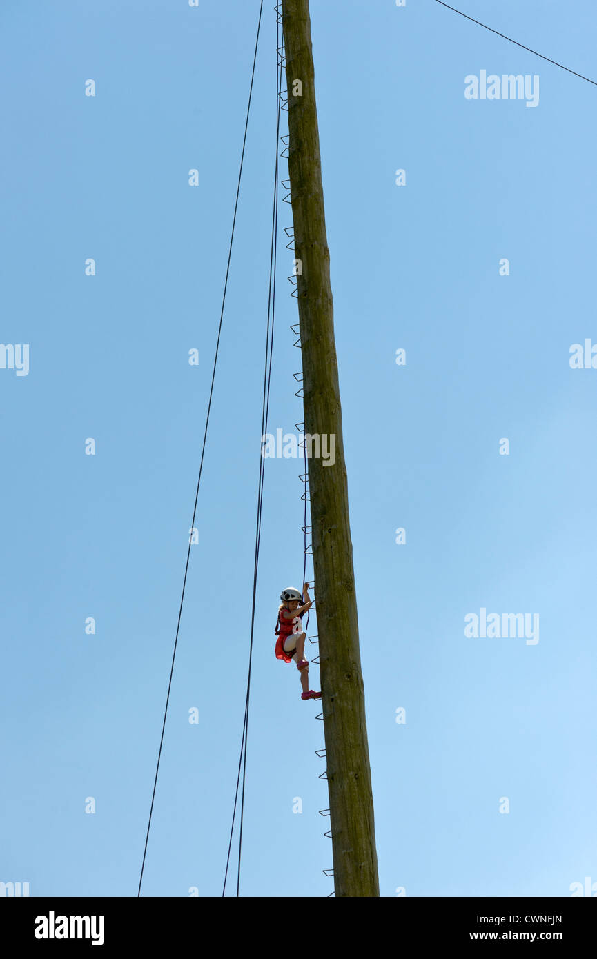 New Forest County Show child climbing pole Stock Photo - Alamy