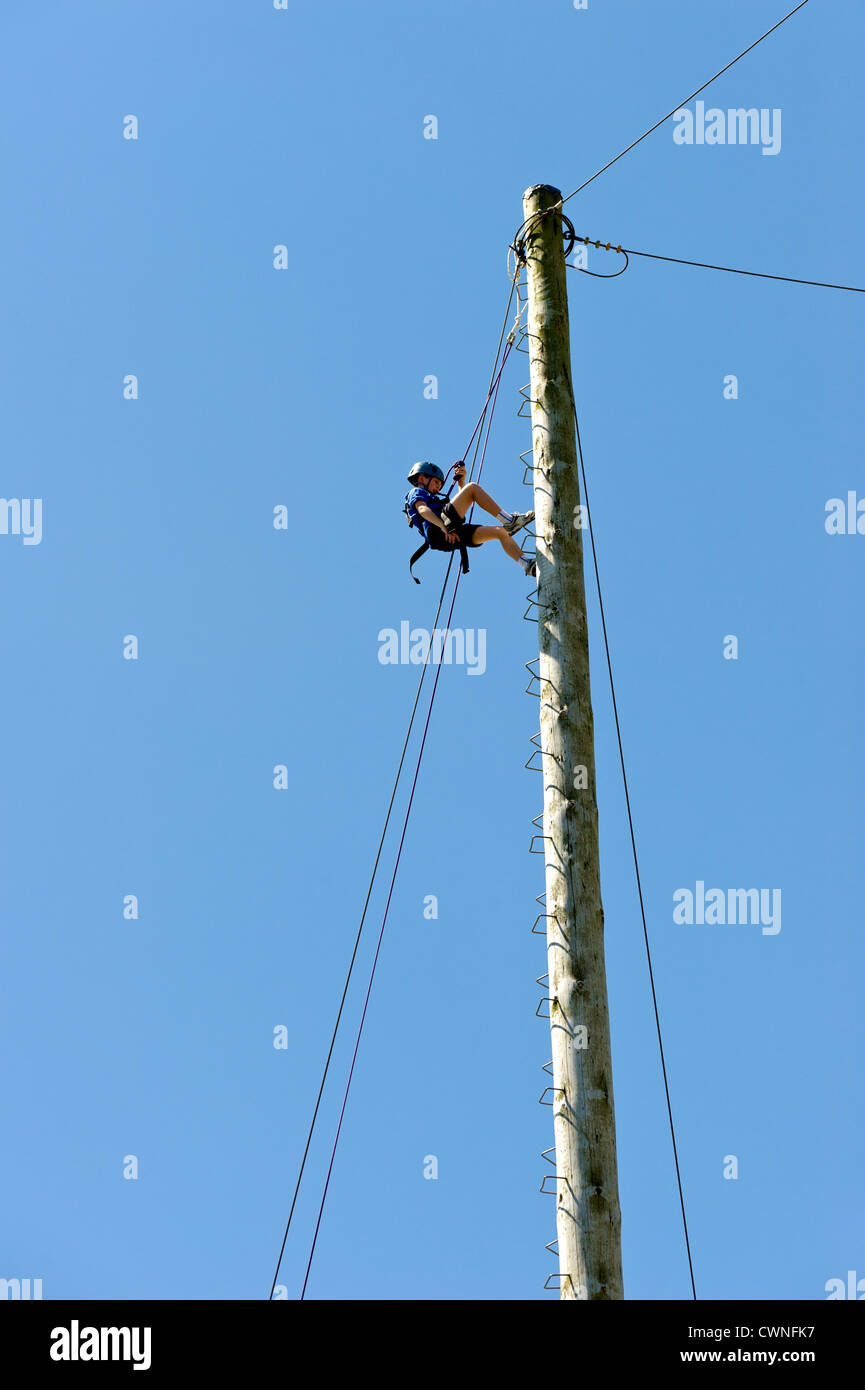 New Forest County Show child climbing pole Stock Photo - Alamy