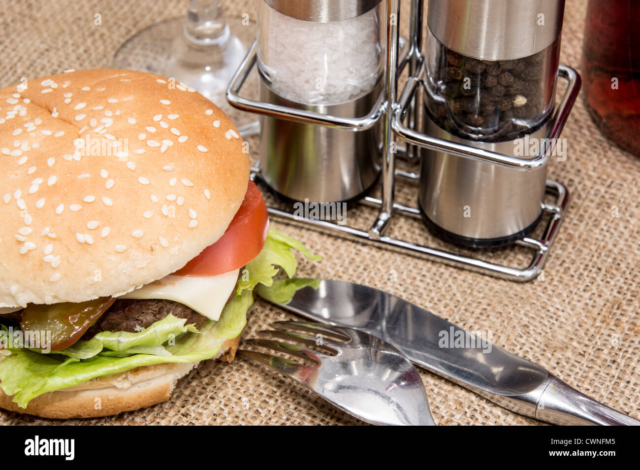 Cheese Burger with ingredients on rustic background Stock Photo - Alamy