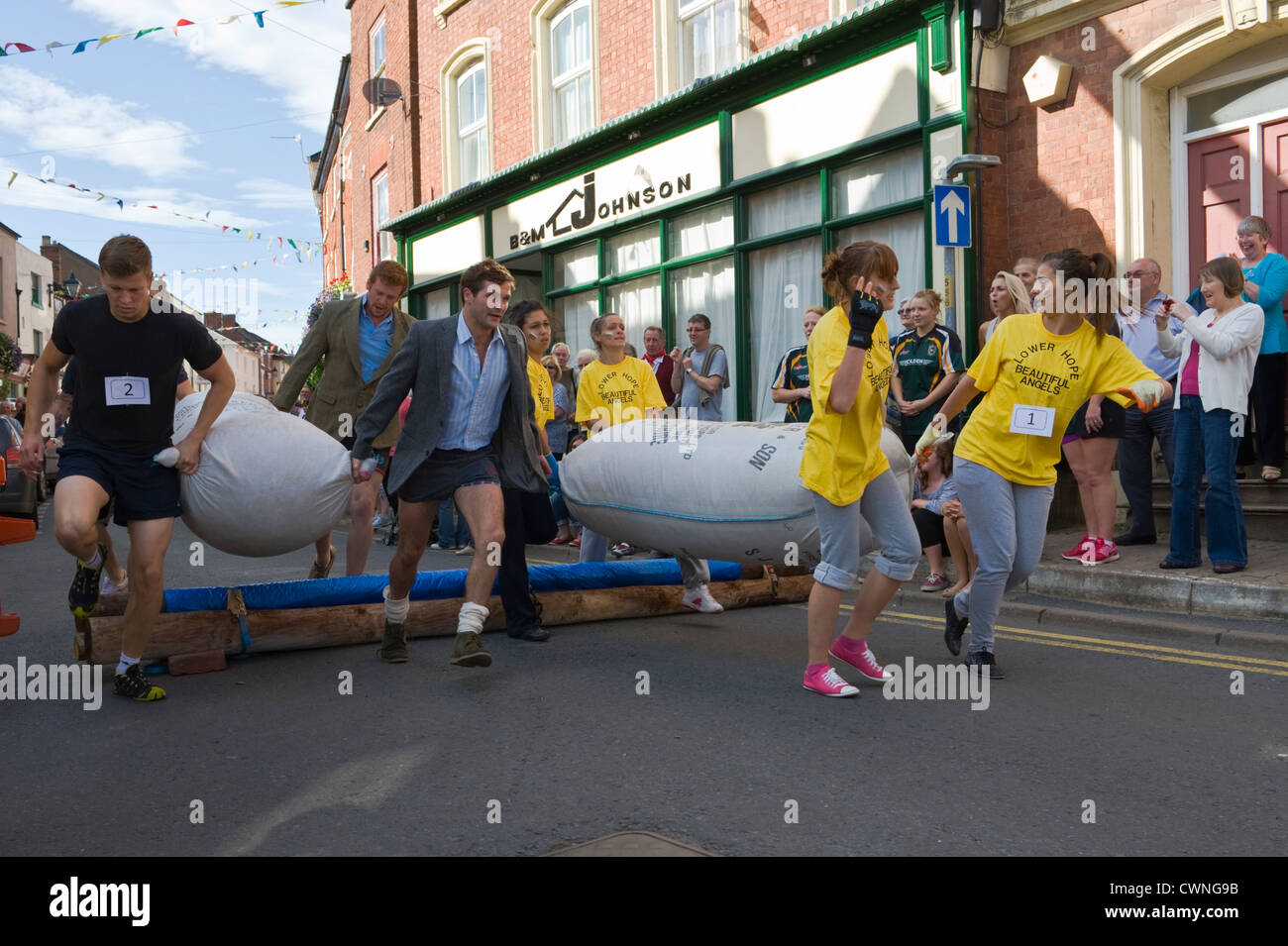 Competitors jump the hurdle in the annual World Championship Hop Pocket ...