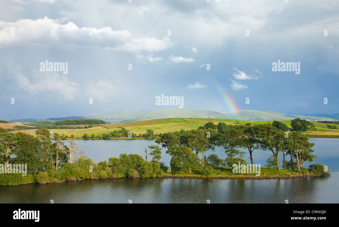 rainbow over a lake Stock Photo - Alamy