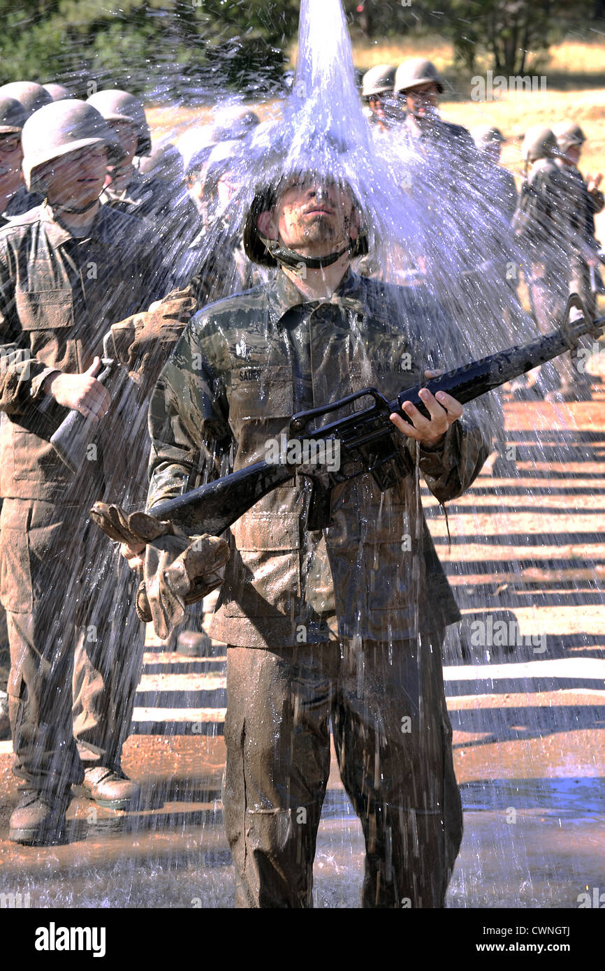 A US cadet rinses off after going through basic cadet training at the U ...