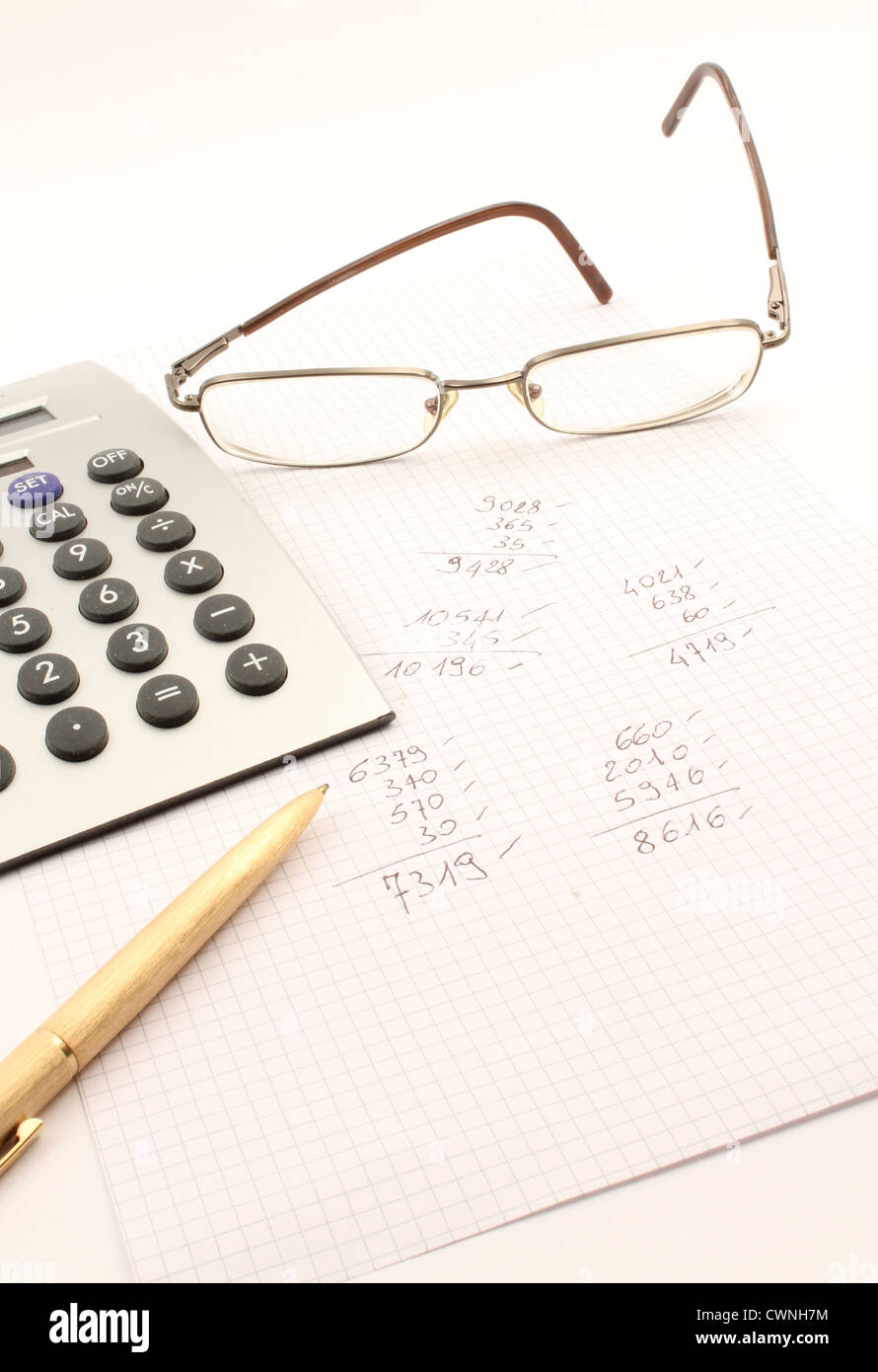 Addition of a written paper, a calculator and pen vintage Stock Photo ...